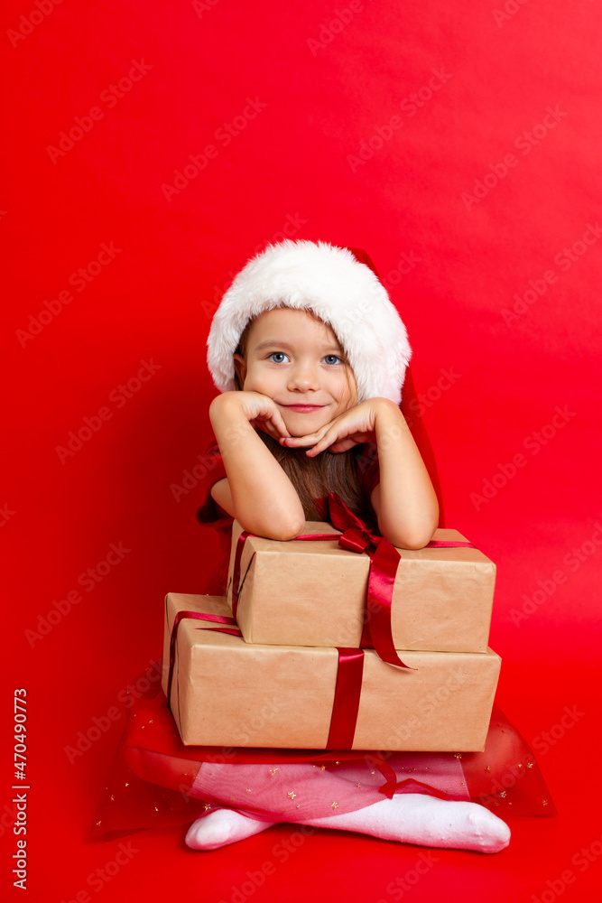 Merry Christmas and happy holidays. Portrait of a pending happy girl in ...