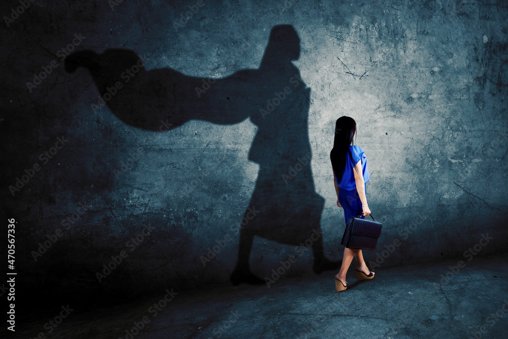 Female manager walking with superhero cape shadow Stock Photo | Adobe Stock