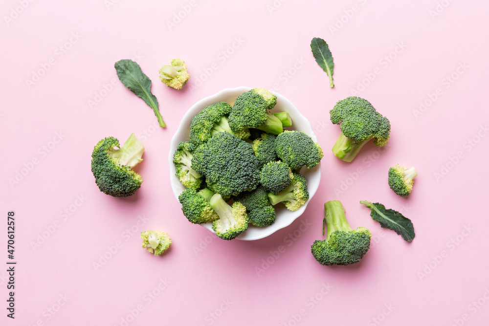 green fresh broccoli background close up on colored table. Vegetables ...