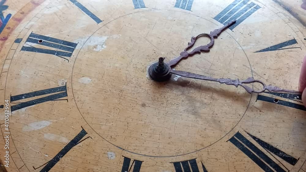 Time is going back on vintage wall clock dial face and hours minutes ...