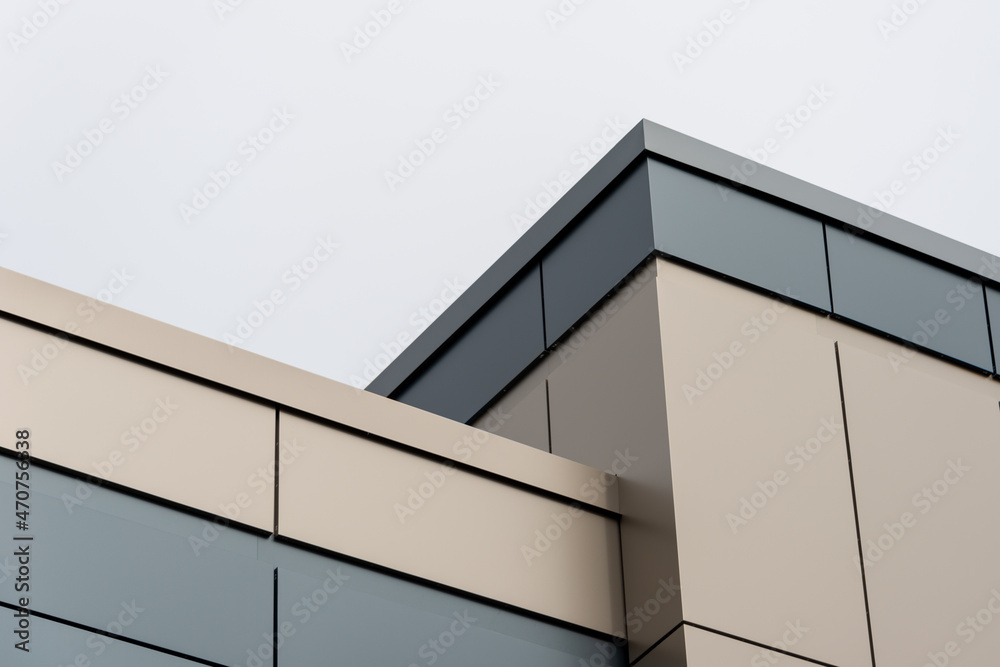 The exterior wall of a contemporary commercial style building with ...