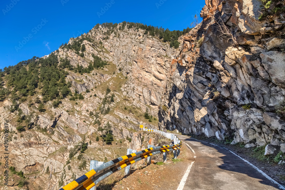 Dangerous high altitude mountain highway road with rocky terrain on ...