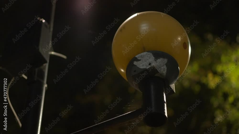 Yellow pedestrian crossing lights blinking by night at a crossroad in ...