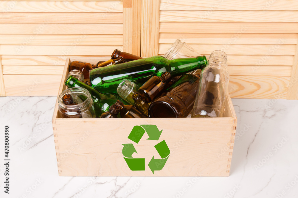 Home separate collection of garbage: glass in wooden box. Glass stuff ...