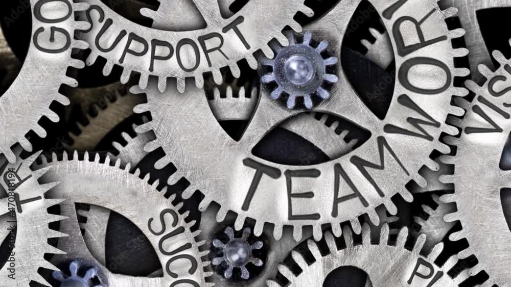 Group of rotating tooth wheels with Teamwork sign imprinted on metal ...