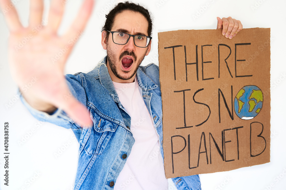 Stop climate change concept. Gen Z demonstrator with glasses throwing ...