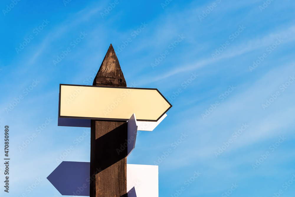 Blank directional road signs against blue sky. Empty arrow with ภาพถ่าย ...