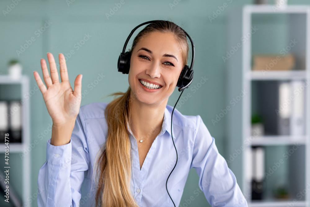 Virtual meeting. Happy businesswoman in headset making video call and ...