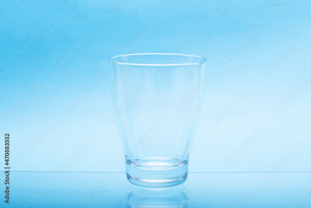 Transparent empty water glasses with blue background. Stock Photo ...