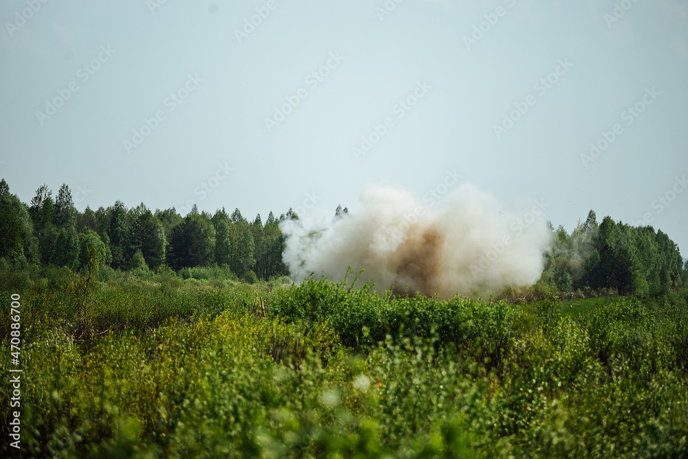 the explosion of a projectile when hitting a target on a military ...