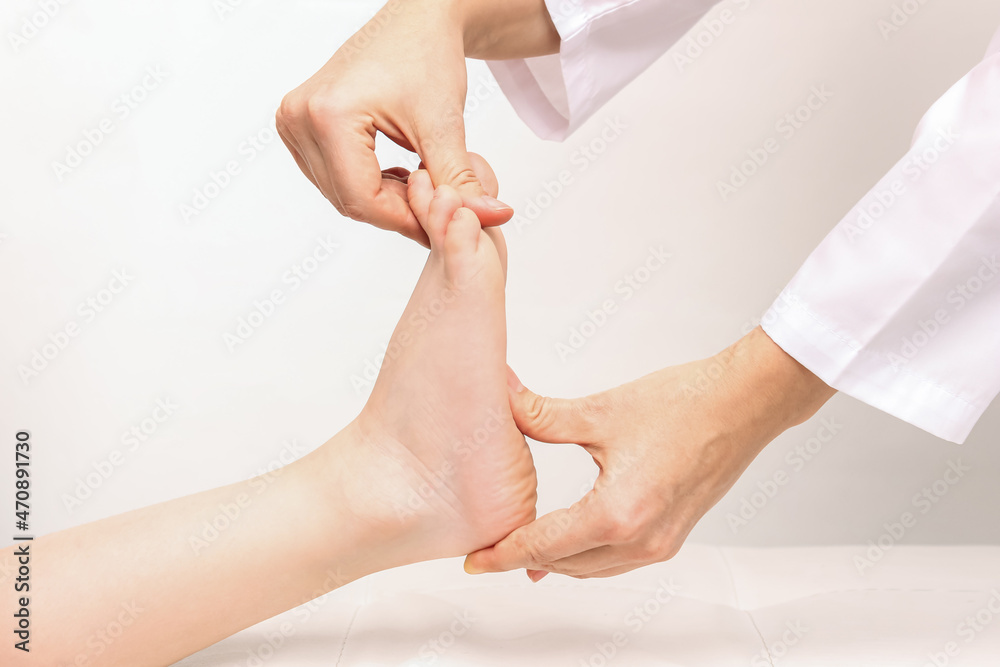 Examination of a child by an orthopedist. Cropped shot of female doctor ...