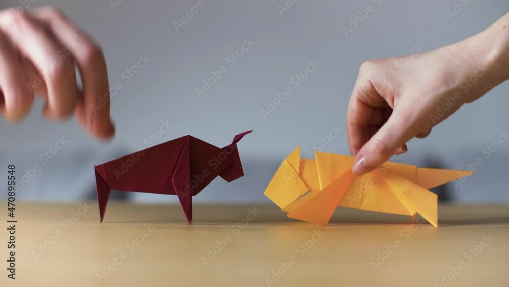 An Origami Tiger and Ox meet on table. New zodiac for Chinese new year ...
