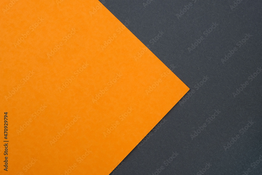 Abstract background from sheets of orange, and black paper. Orange ...