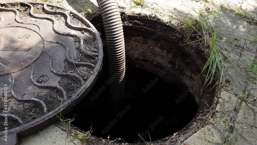 An open manhole in the courtyard of a private house . Image of the ...