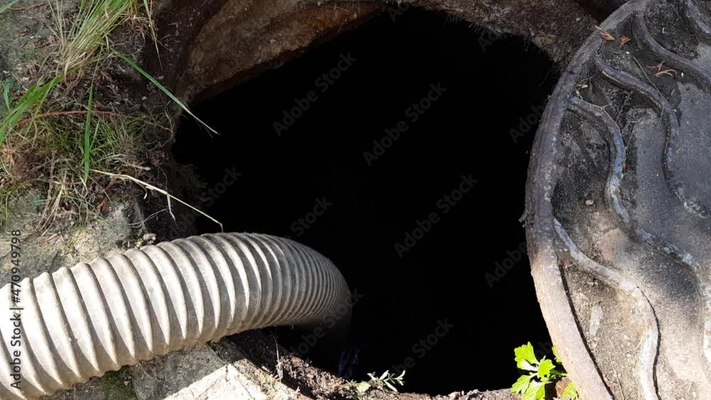 An open manhole. Image of the nodes of the pumping machine for pumping ...