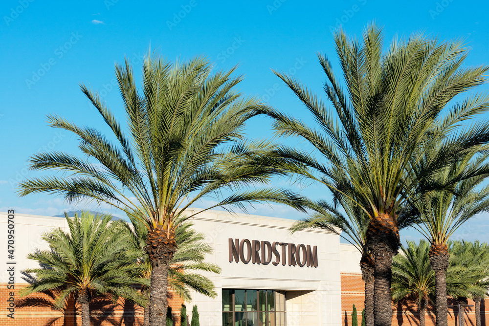 Nordstrom sign, logo above the store entrance behind palm trees ...
