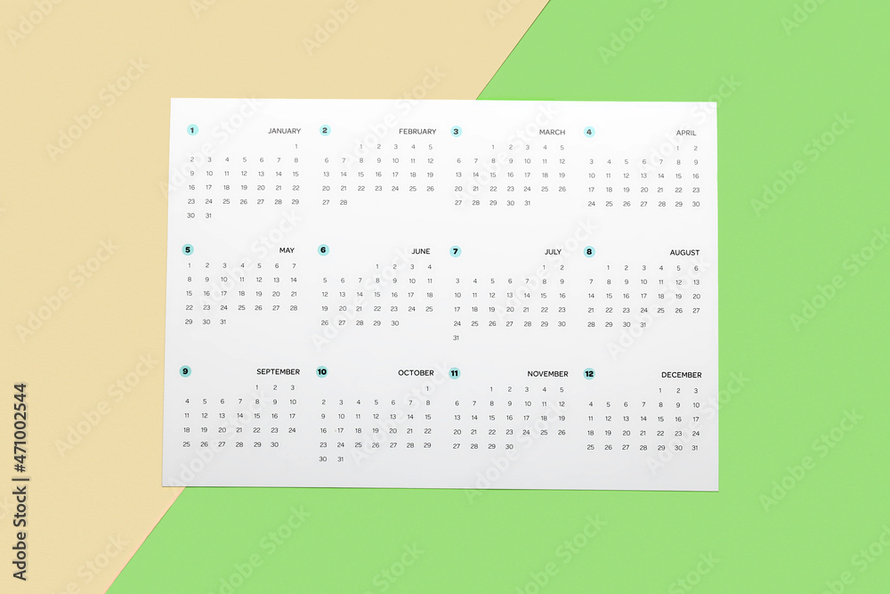 Paper calendar on color background Stock Photo | Adobe Stock