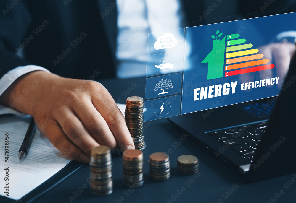 Businessman calculating energy efficiency rate. Energy efficiency ...