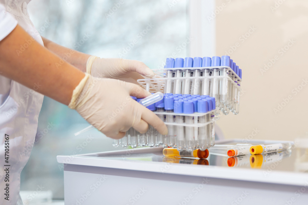 Test tube in scientist hand in laboratory. Doctor in uniform working ...