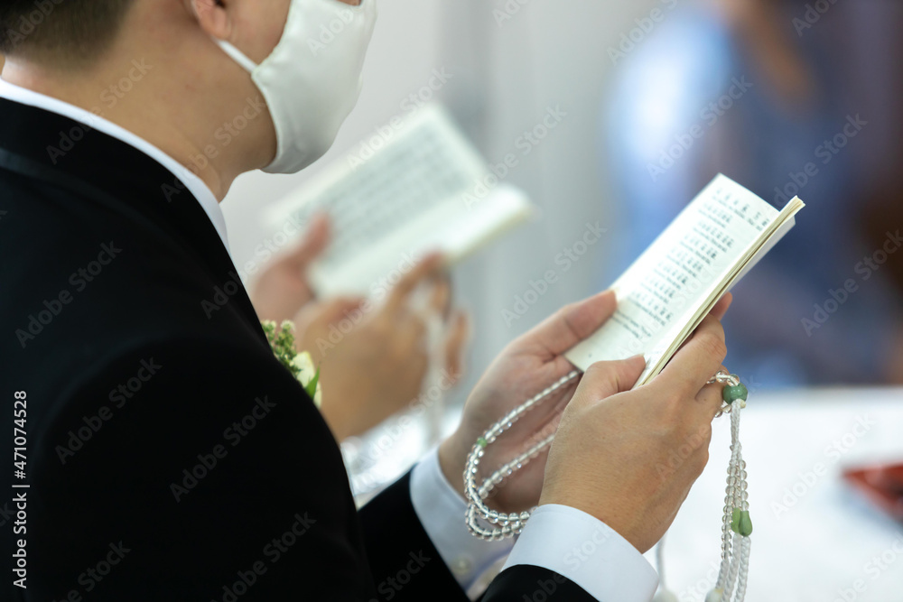 Prayer and holding prayer book and jutsu beads in japanese buddhist ...