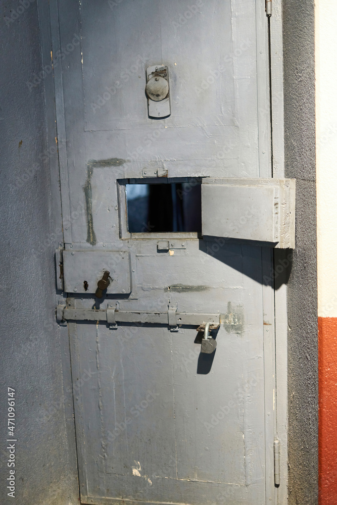 Prison cell iron door with observation window and steel bolts Stock ...