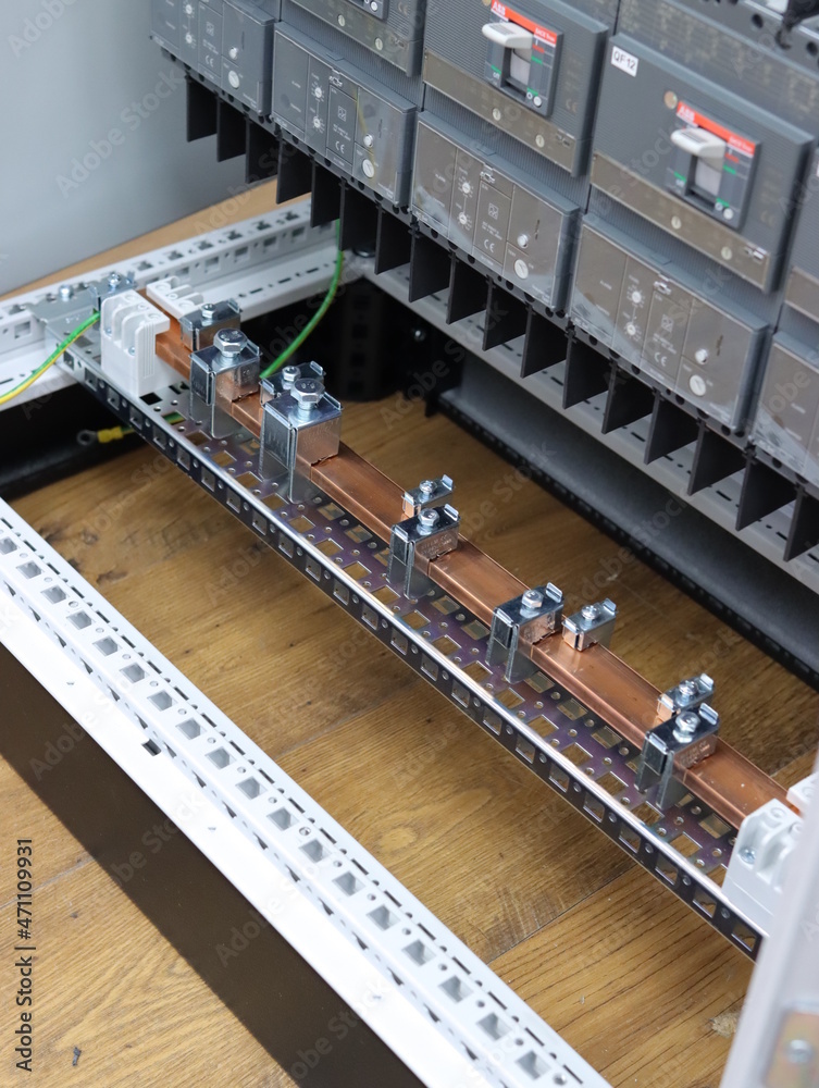 Copper busbar for protective grounding in the electrical panel. Stock ...
