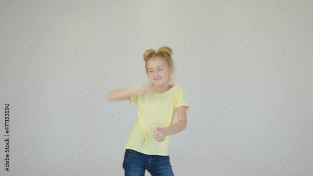 cute girl dancing fun in the studio on a white background. 4K images ...