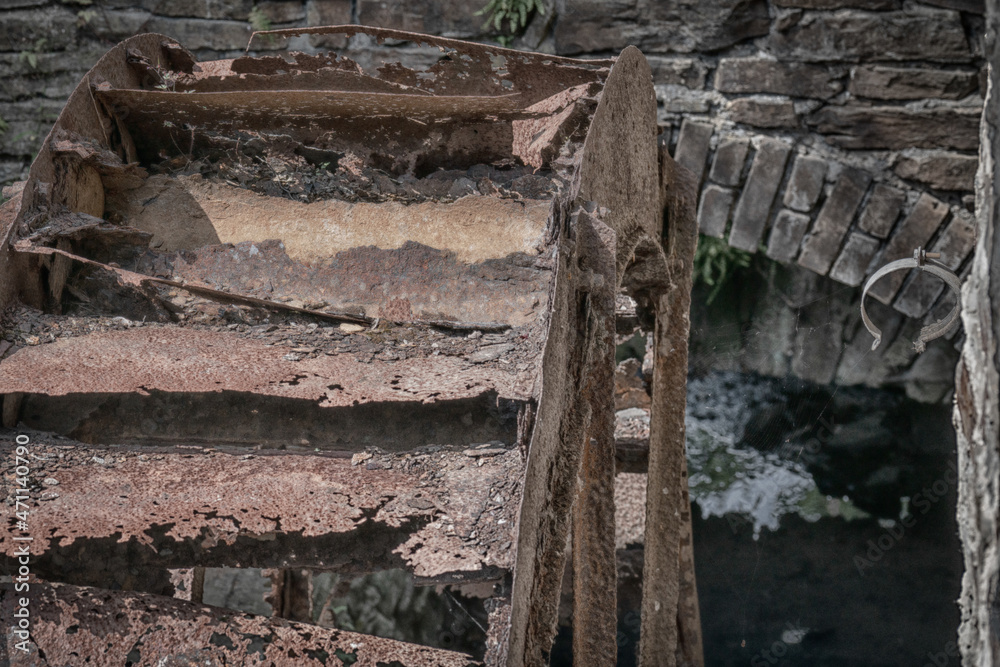 Rusty mill wheel in its traditional place in cutout. Stock Photo ...