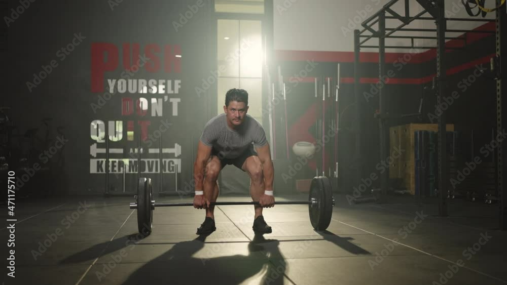 Video Stock Athlete Bodybuilder man fitness trainer stand, lift up ...