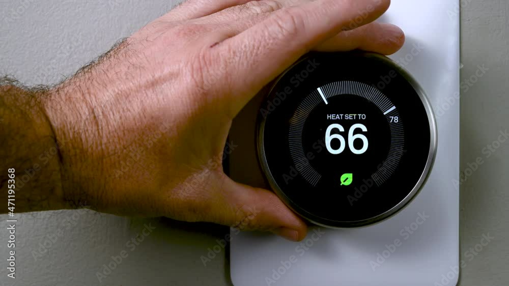 Adjusting temperature on a smart thermostat for home Stock ビデオ | Adobe ...