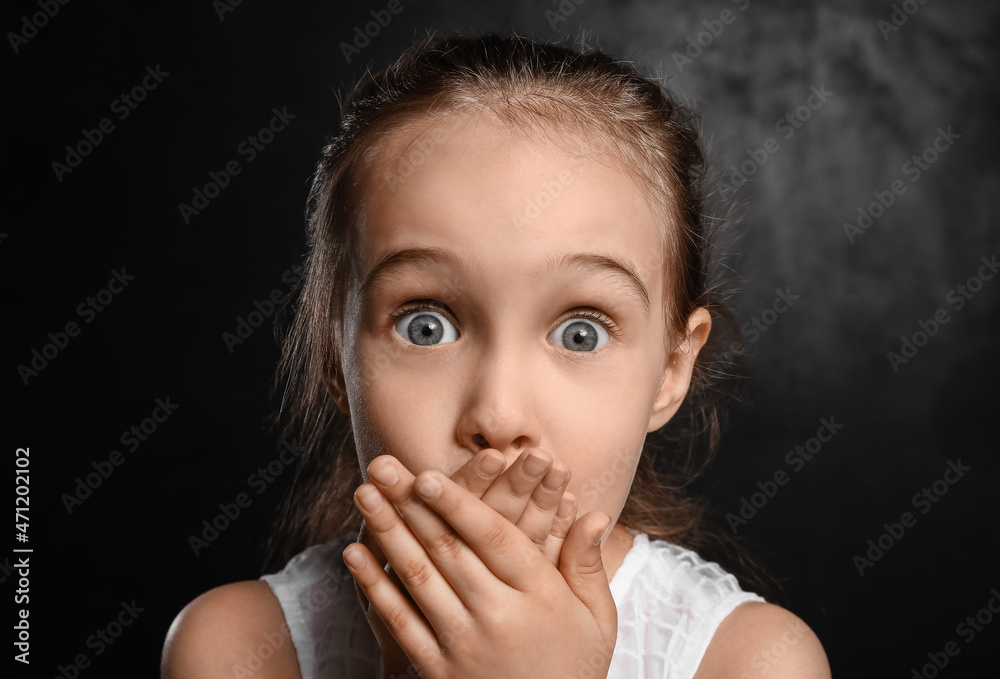 Portrait of shocked little girl on black background, closeup Stock ...