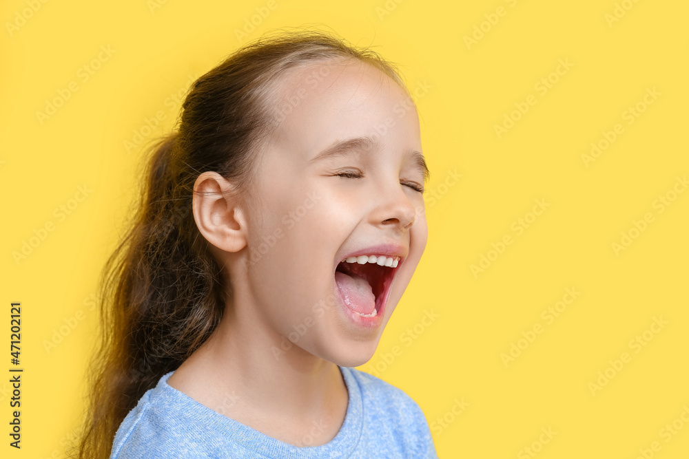 Portrait of shouting little girl on yellow background, closeup Stock ...