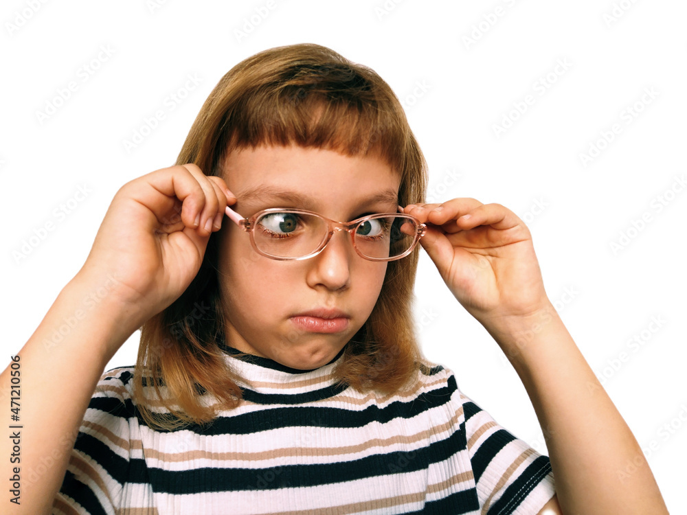 Cute 7 year old Caucasian girl looks into glasses. Eyes in a bunch ...