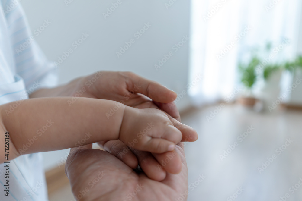 Parents and children's hands at home. Family holding hands. Father and ...