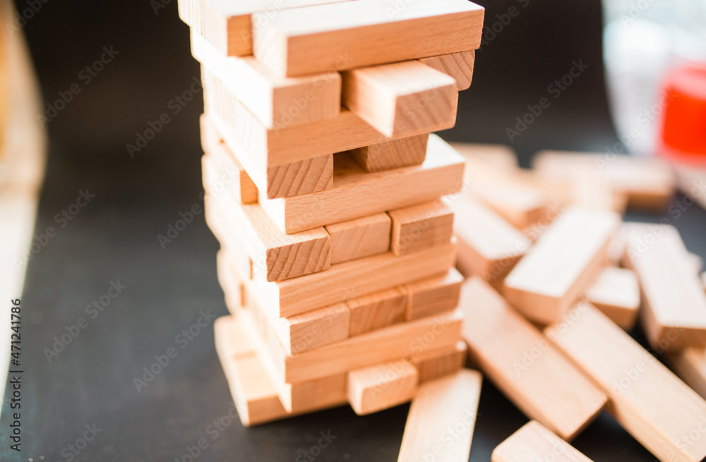 Education, risk, development and growth concept. jenga game. The ...
