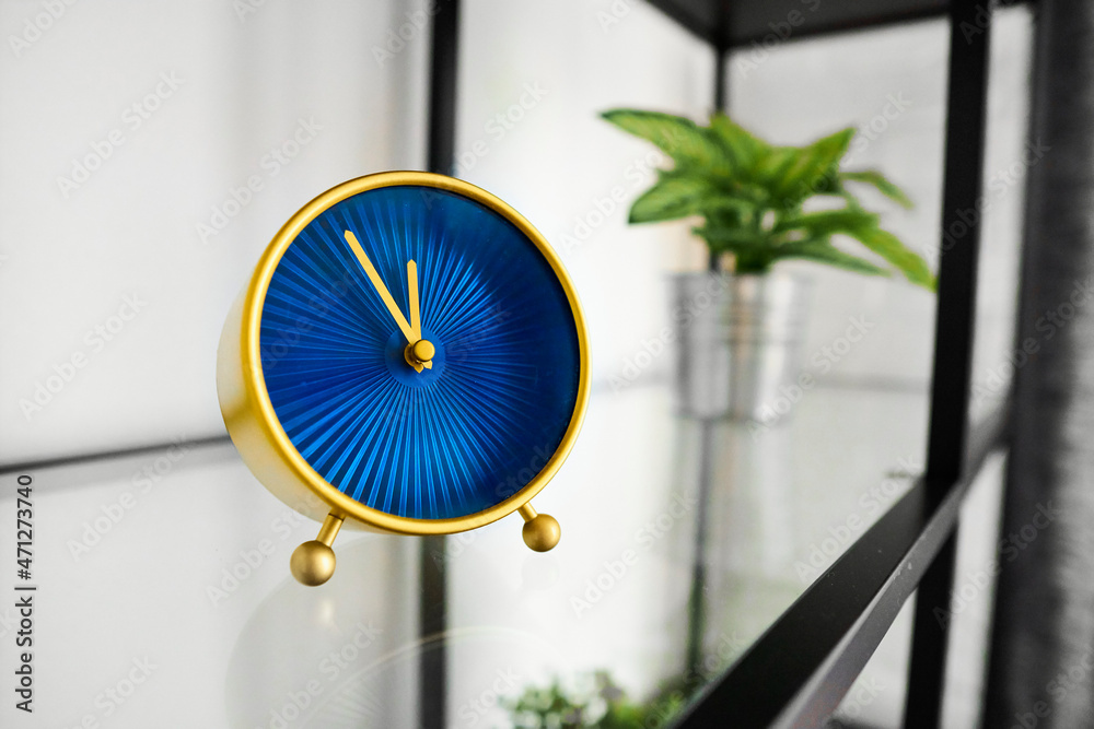 Popular round clock with hour and minute hands on glossy surface in ...