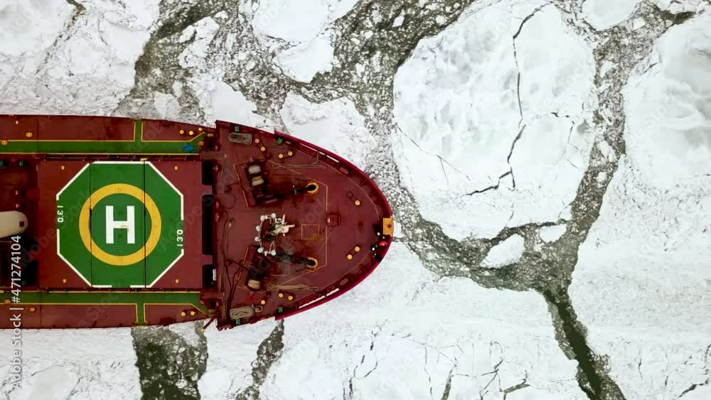 Drone top down Epic red steel icebreaker ship tanker breaks winter ...