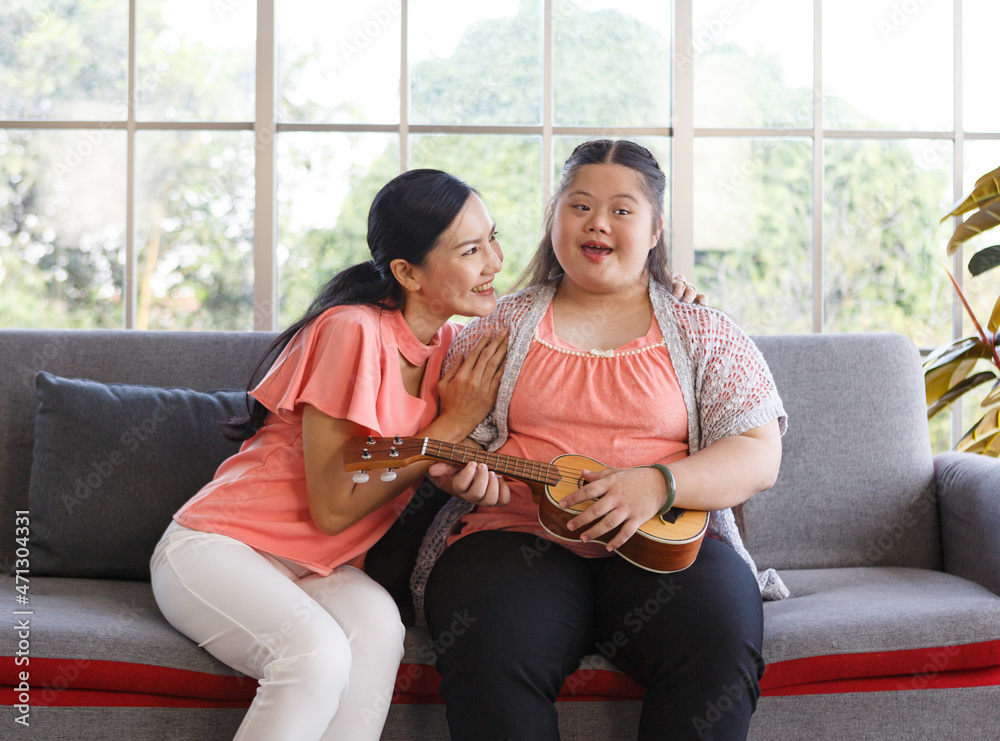 happy family mother with the cute girl who is a star Sildom sitting on ...