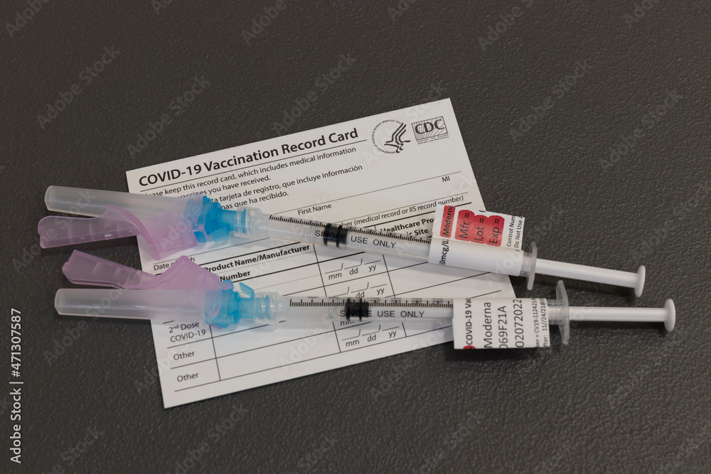 Moderna COVID-19 Vaccination booster syringes or hypodermic needles and ...