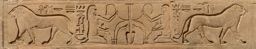 Two figures of god Hapi representing upper and lower Egypt tying lotus ...