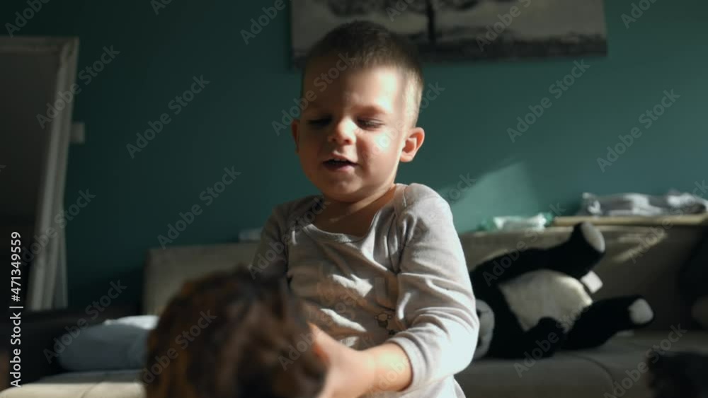 Cute little boy with angry face playing with his lion toy. Cute little ...