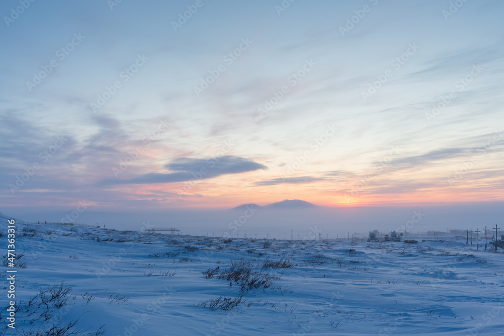 Sunset in the tundra. Early winter twilight. Cold frosty winter weather ...