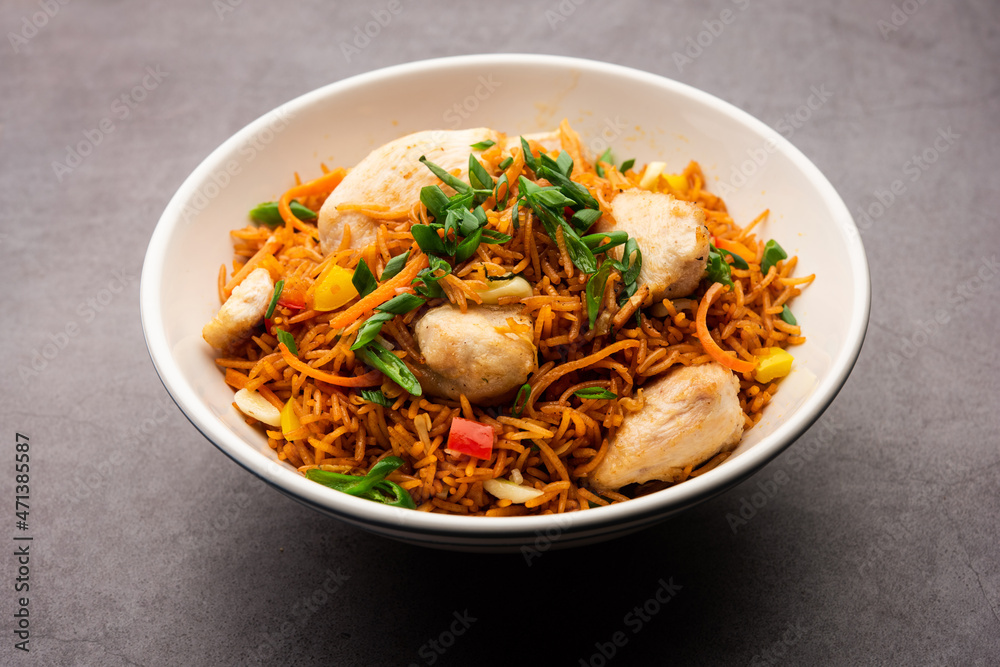 schezwan chicken fried rice Stock Photo | Adobe Stock