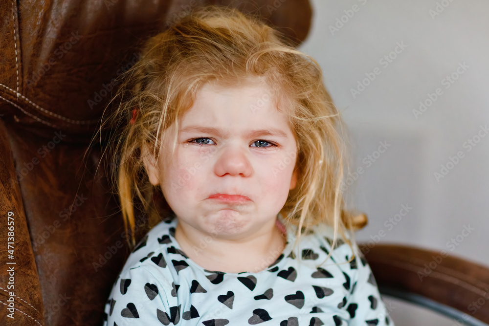 Cute adorable crying sad toddler girl. Little angry sleepy baby girl at ...
