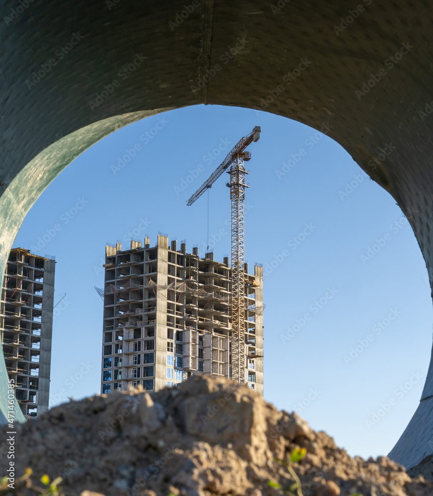 Vertical photo of the construction site and building of high buildings ...