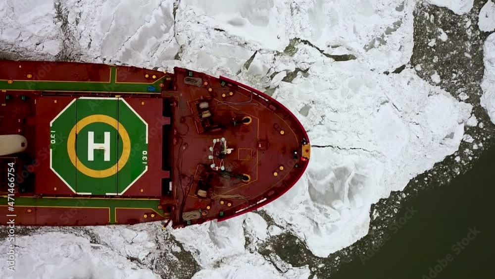 Drone top down Epic red steel icebreaker ship tanker breaks winter ...