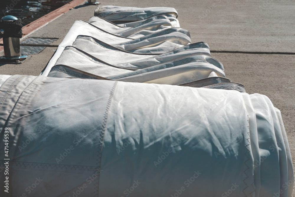 Rolled or folded sails for winter storage, sailmaking and maintenance ...