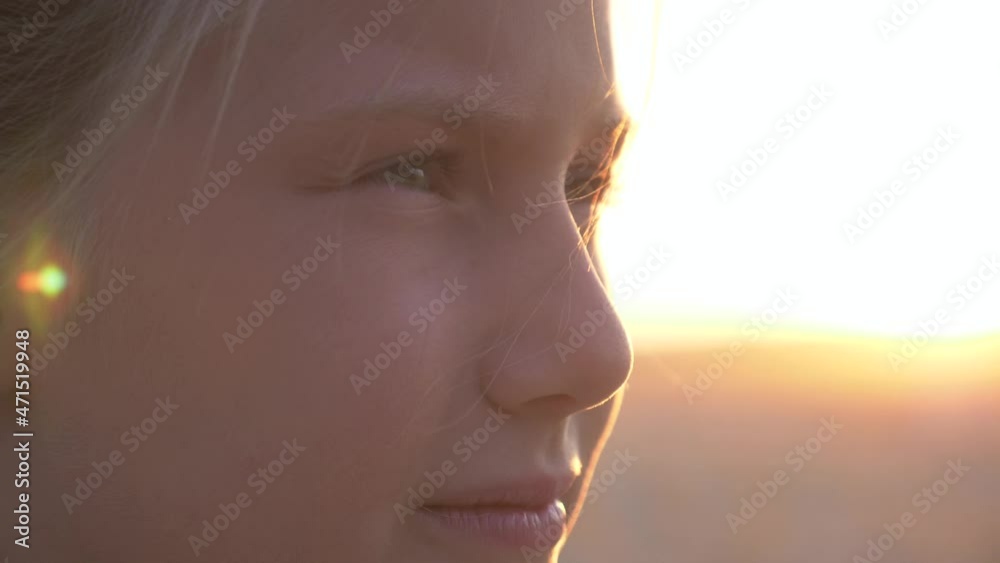 face of happy young girl in summer smiling at sunset. Outdoor portrait ...