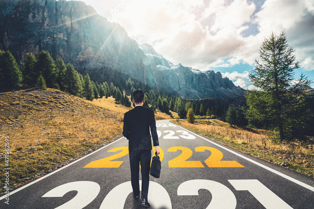 The 2022 New Year journey and future vision concept . Businessman ...
