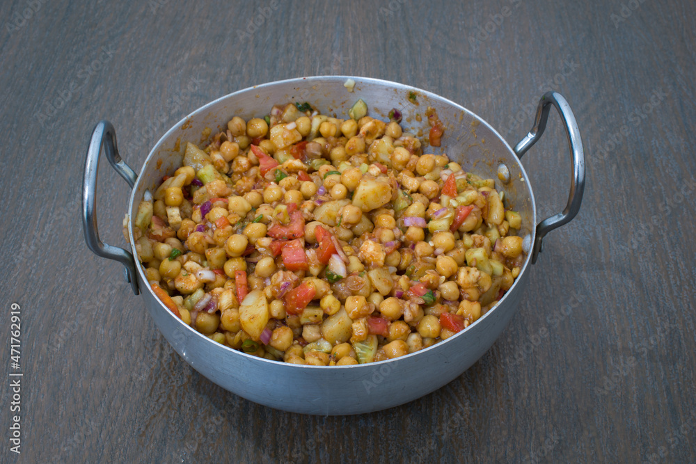 Indian delicious home made chaat of chickpeas, tomatoes, different ...